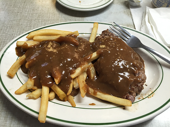 Hot hamburger steak swimming in gravy – the kind of comfort food that makes everything right again.