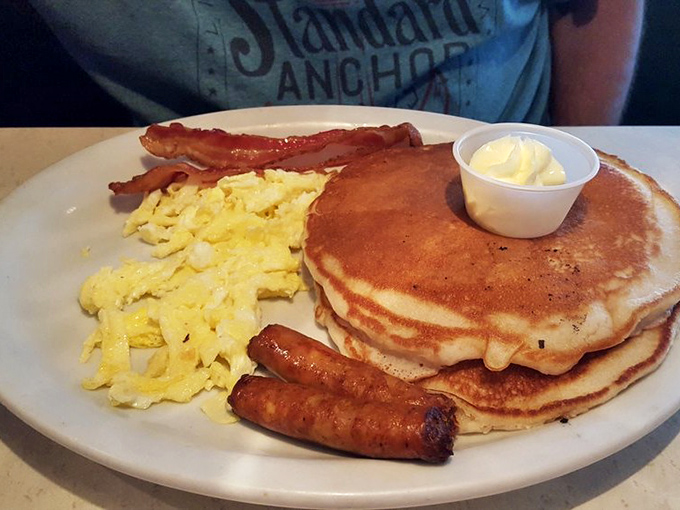 The breakfast that asks, "Got plans today? Cancel them." Pancakes, eggs, and breakfast meats arranged in perfect harmony on a single plate.