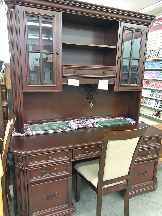 This isn't just furniture&mdash;it's a command center for someone's home office dreams, complete with glass-fronted cabinets for important-looking books.