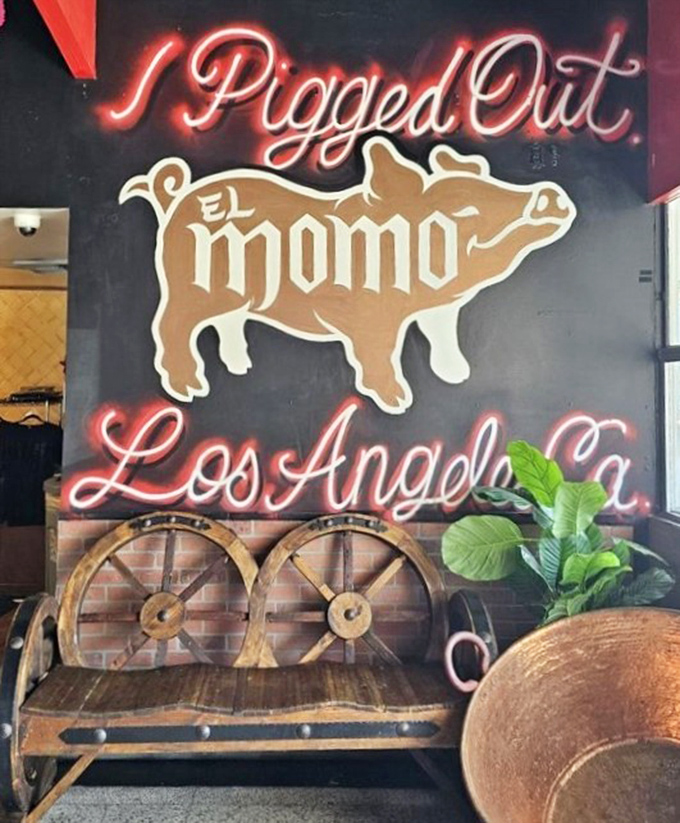 "I Pigged Out" glows in neon, not just a clever sign but a prophecy for everyone who walks through the door.