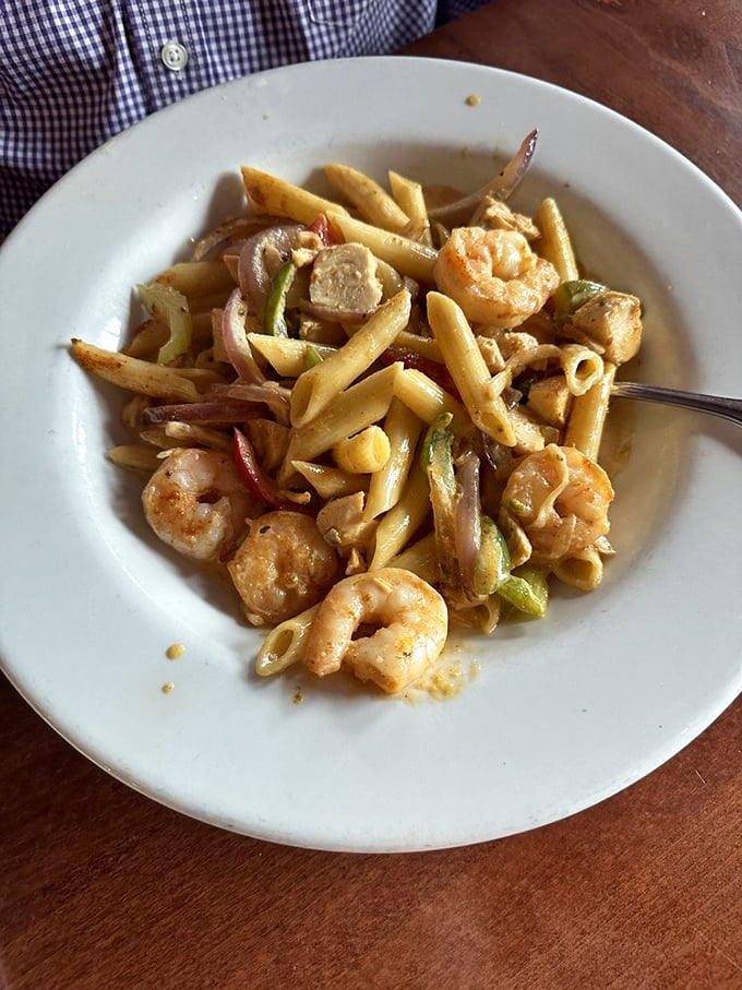 Jambalaya pasta where New Orleans meets Italy for dinner. Those plump shrimp are having the time of their lives in that creamy sauce.