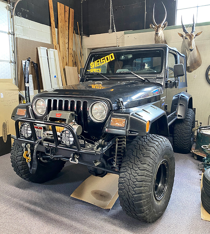 This Jeep isn't just transportation; it's an adventure waiting to happen&mdash;with taxidermy witnesses keeping watch from above.