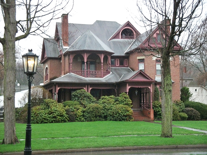 This pink-trimmed Victorian beauty looks like it should be on a historic home tour. Gingerbread details and wraparound porches never go out of style.