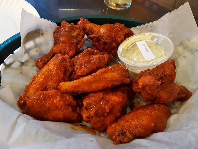 Buffalo wings should be messy enough to require at least three napkins. These beauties clearly pass the test with flying, sauce-covered colors.