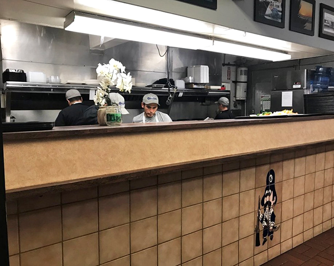 Behind every great seafood plate is a kitchen crew that knows exactly what they're doing. No fancy techniques, just seafood respect.