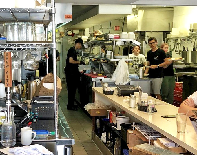 The kitchen hums with purpose &ndash; this is where the magic happens, one perfectly fried fish at a time.