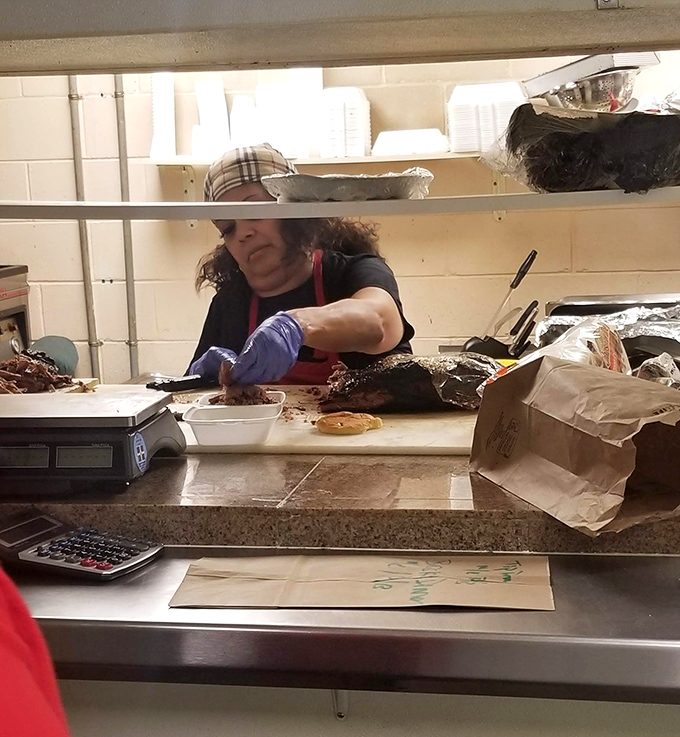 Behind the scenes magic – where skilled hands transform humble cuts into neighborhood legends one slice at a time.