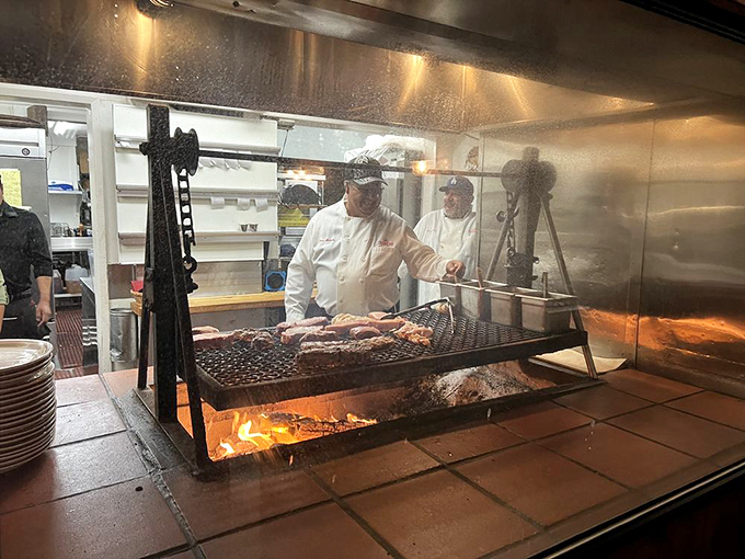 Culinary choreography in action. The grill masters orchestrate a symphony of sizzle, transforming raw ingredients into oak-kissed perfection.