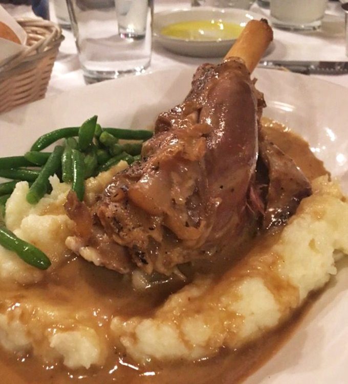 This lamb shank isn't just falling off the bone&mdash;it's practically writing a breakup letter to it, while nestled on cloud-like mashed potatoes.