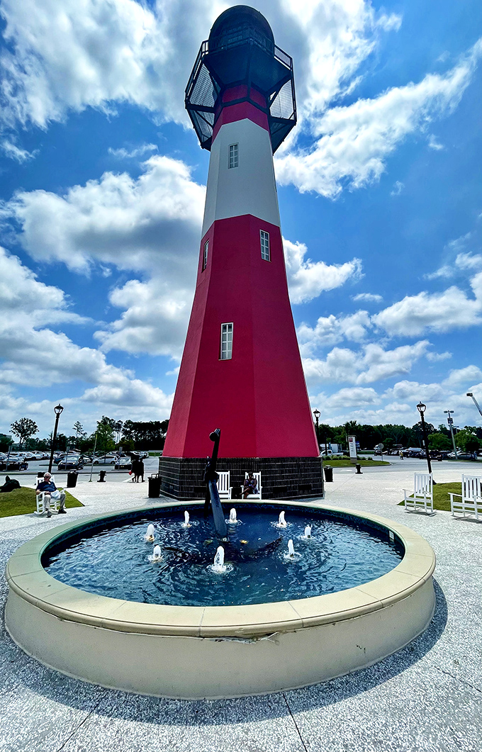 The lighthouse stands as a beacon for bargain hunters, guiding shoppers safely through the treacherous waters of full retail prices to the shore of sweet deals.