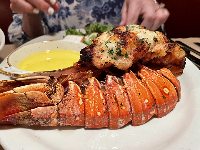 This lobster tail isn't just dinner &ndash; it's maritime majesty on a plate, split and broiled to sweet, tender perfection.