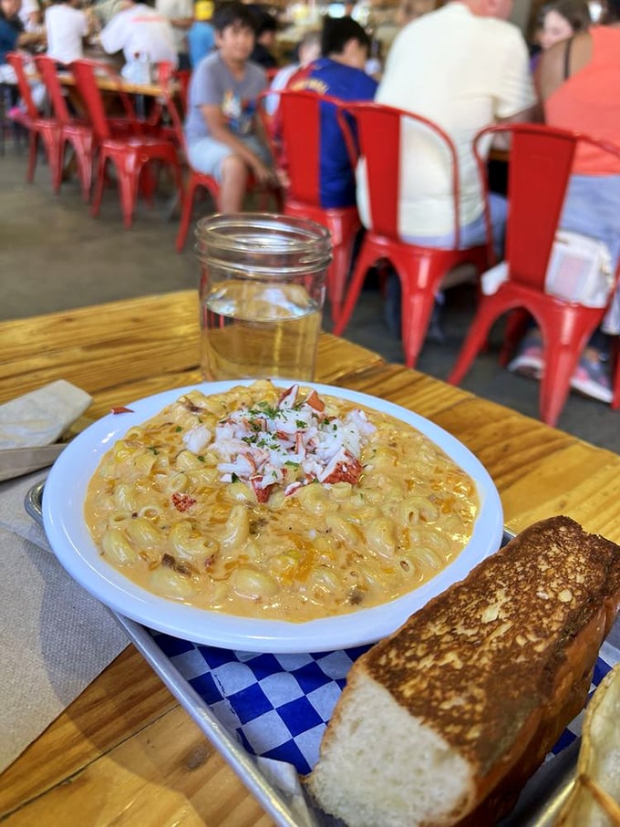 Lobster mac and cheese&mdash;where comfort food gets dressed up for a fancy night out. That golden crust hides a creamy treasure trove below.