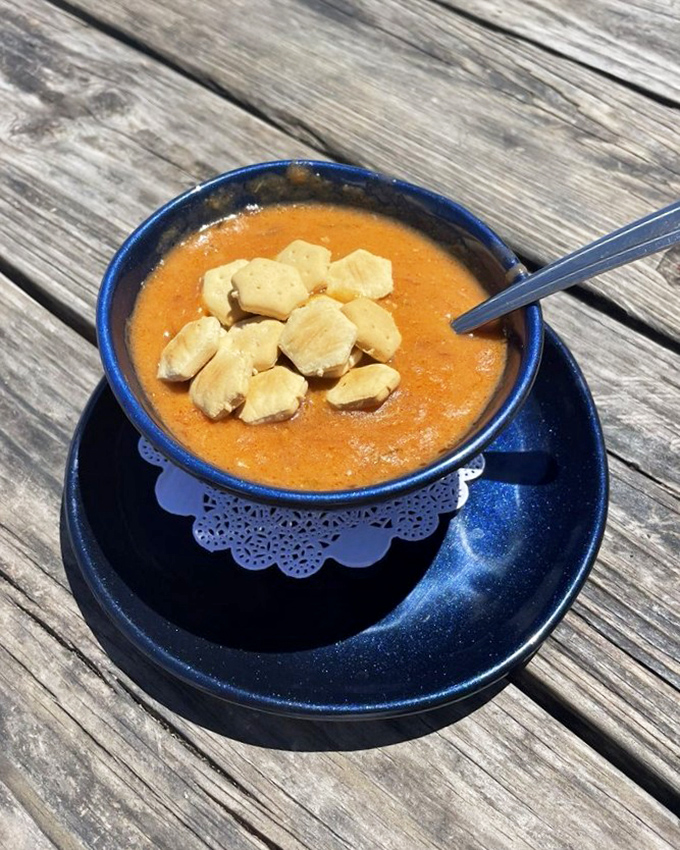 A bowl of lobster bisque that whispers sweet nothings to your taste buds. Those oyster crackers aren't just garnish&mdash;they're essential companions.