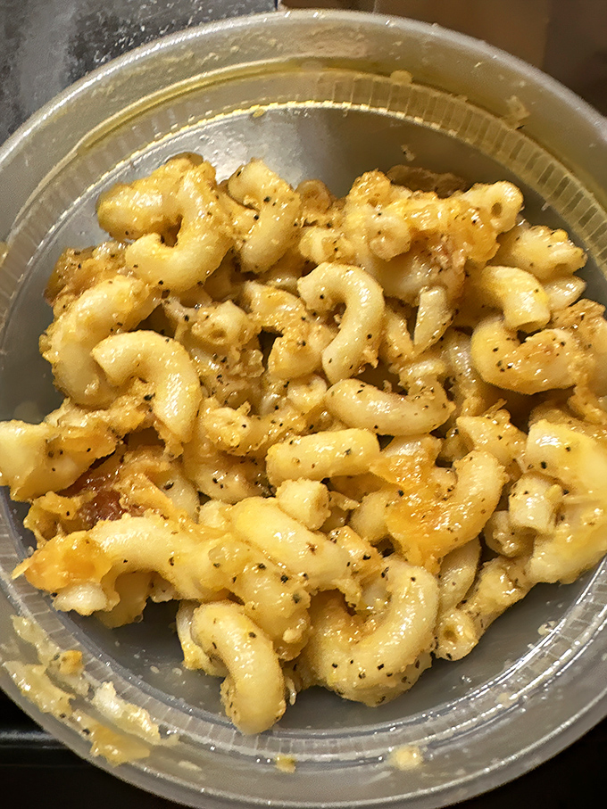 Mac and cheese that puts the boxed stuff to shame. Each bite is a creamy, cheesy reminder of what comfort food should be.