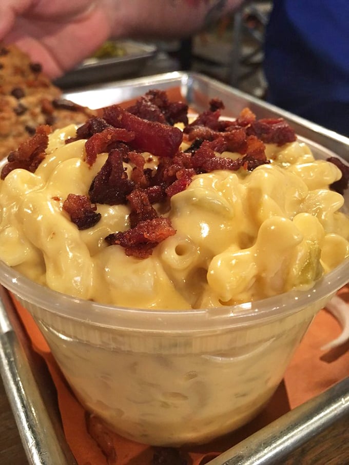 Mac and cheese topped with bacon bits isn't just a side dish—it's what comfort food dreams about when it goes to sleep at night.