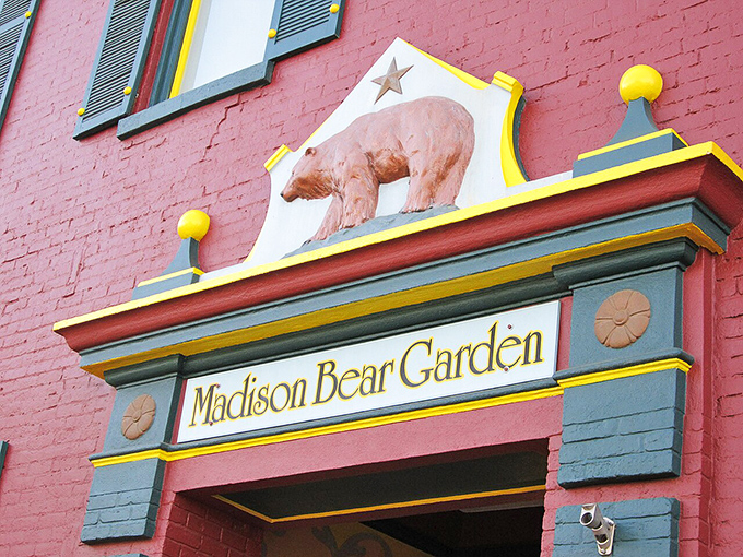 Madison Bear Garden's whimsical entrance promises the kind of dining experience where calories don't count and conversations flow as freely as the beverages.