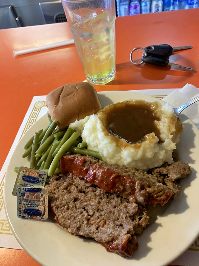 Meatloaf with mashed potatoes isn't just dinner—it's a time machine to when comfort wasn't ironic and gravy was considered a perfectly acceptable beverage.