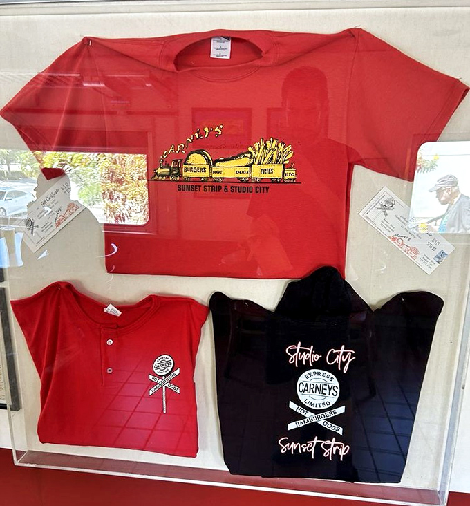 Carney's merchandise proudly displays the iconic yellow train – because sometimes wearing your favorite burger joint on your chest is perfectly reasonable behavior.