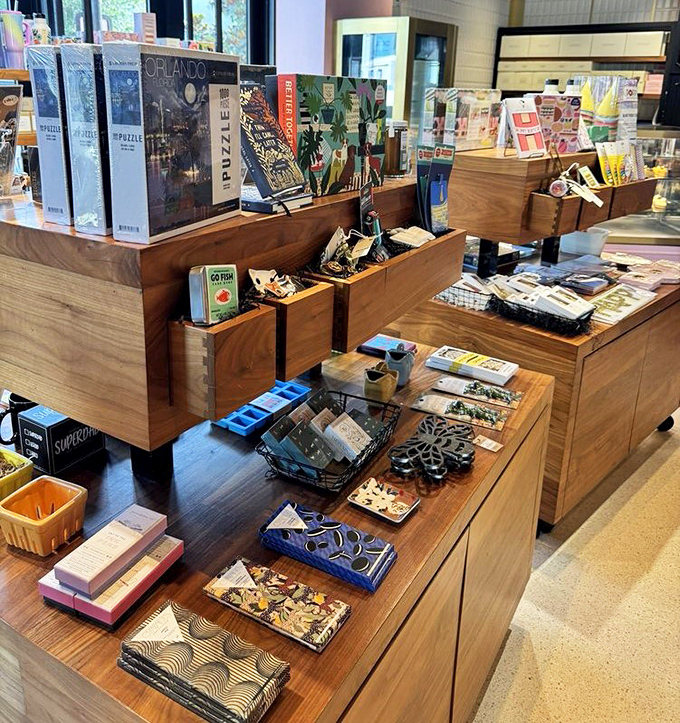 The merchandise corner offers take-home treasures&mdash;because when the dessert memory fades, a Glass Knife puzzle or cookbook keeps the sweet connection alive.