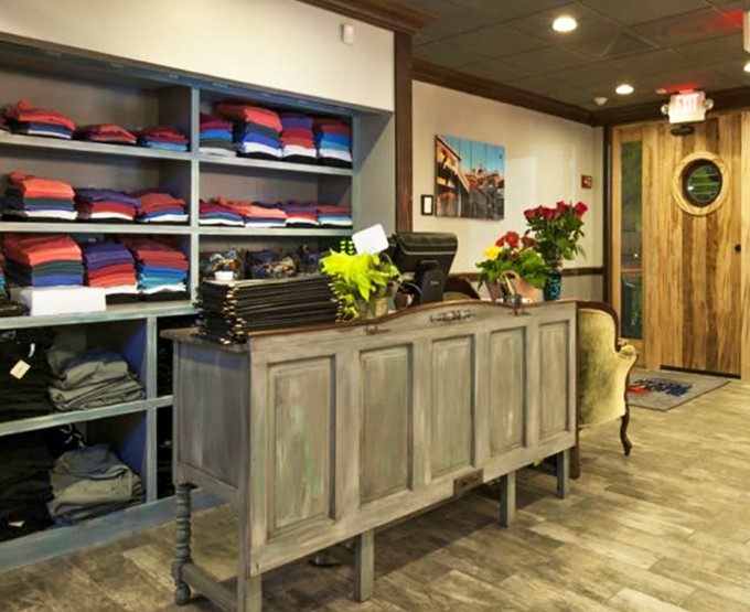 Take home a souvenir that won't spoil in the car. Coastal memories folded neatly on shelves.