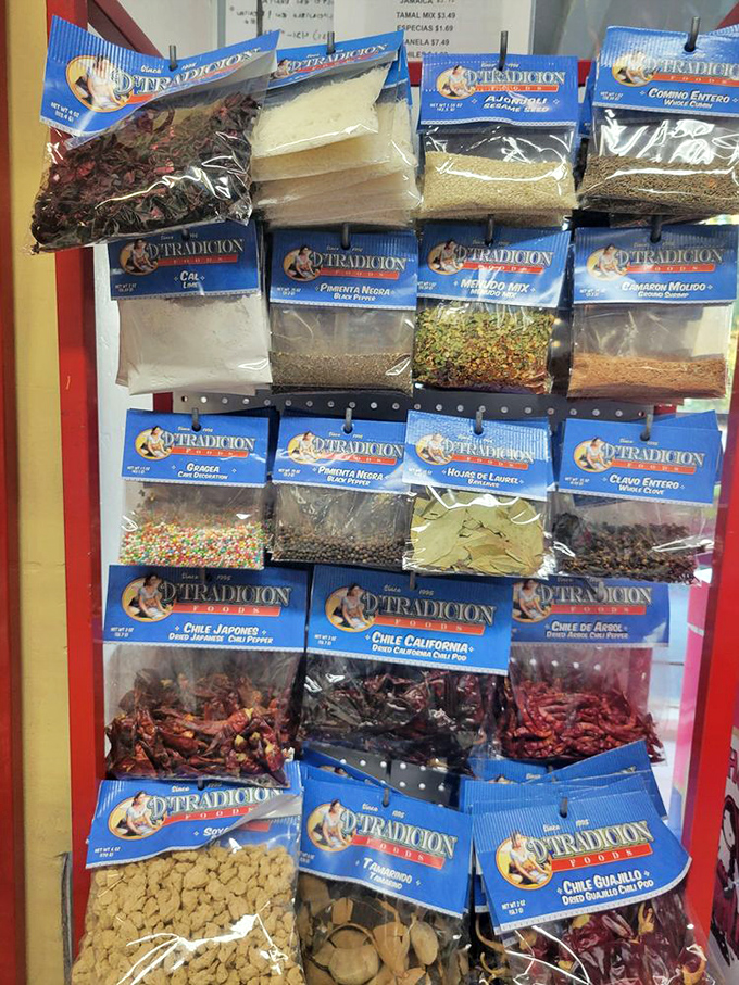 A wall of spices and dried chiles—the building blocks of authentic Mexican flavors. Each packet contains generations of culinary wisdom.