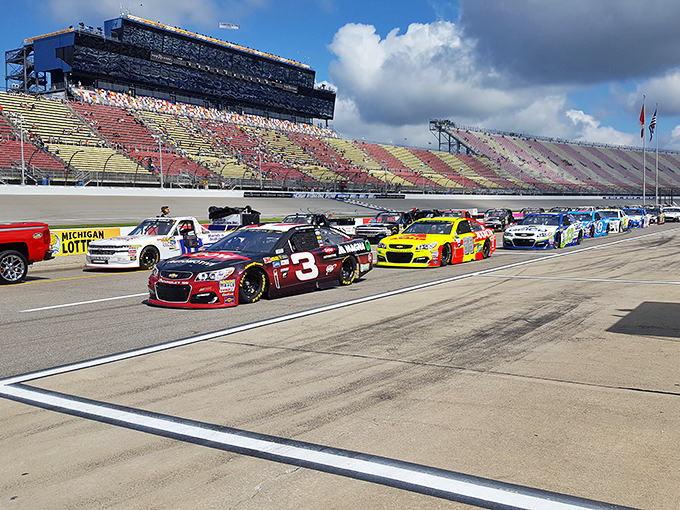 NASCAR vehicles line up for action at Michigan International Speedway, Brooklyn's claim to motorsports fame.