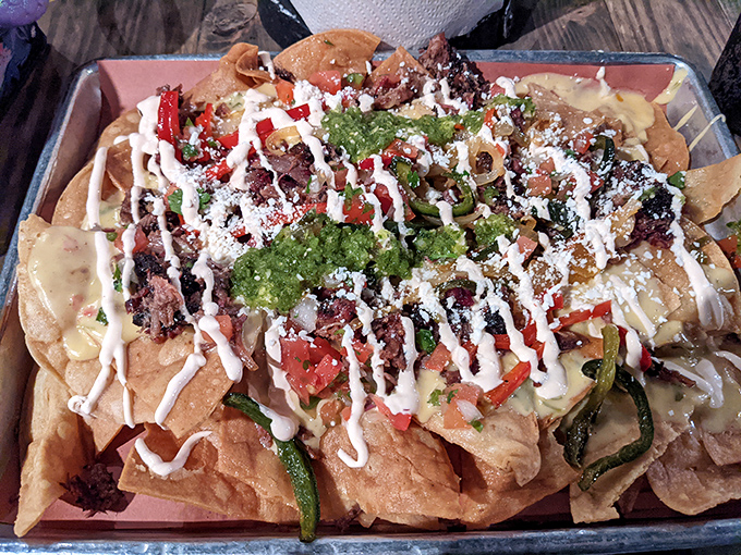 These aren't just nachos&mdash;they're an architectural marvel of chips, cheese, meat, and toppings that somehow maintains structural integrity until the last bite.