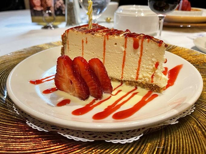 Cheesecake that demands a moment of silence. Those strawberry streaks aren't just garnish; they're exclamation points at the end of a perfect meal. 