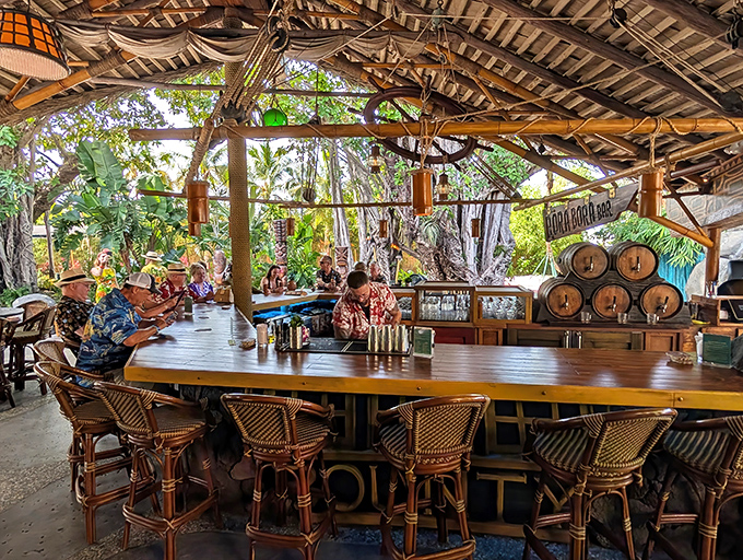 The Molokai Bar's outdoor section feels like the world's most comfortable treehouse, where rum flows and worries evaporate like Florida morning dew.