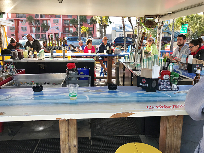 This outdoor bar is where "I'll just have one drink" turns into "I've been here three hours and now know everyone's life story."