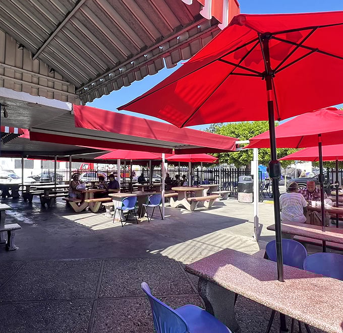 Red umbrellas create an oasis in concrete downtown. The outdoor seating area offers a perfect stage for the main event: devouring impossibly fresh seafood.