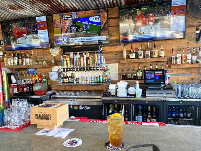Multiple screens and cold drinks create the perfect sports-watching headquarters for any serious fan.