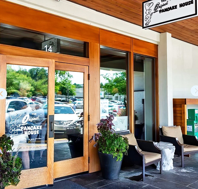 Wooden doors that might as well be portals to flavor town. Even the plants look excited about breakfast.