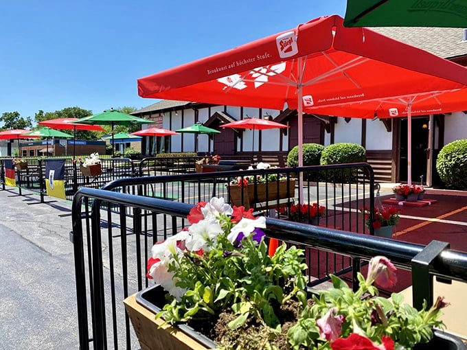 The biergarten blooms with colorful umbrellas and flowers, creating a perfect summer oasis for pretending you're in Munich instead of Illinois.