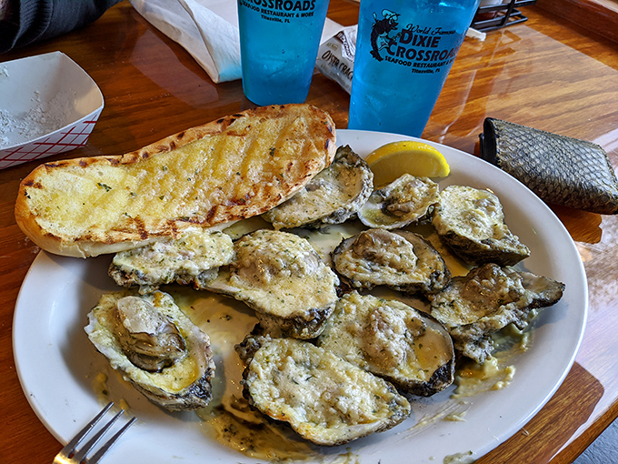 These oysters aren't just served &ndash; they're presented like the briny treasures they are. That garlic bread stands ready to soak up every last drop of buttery goodness.