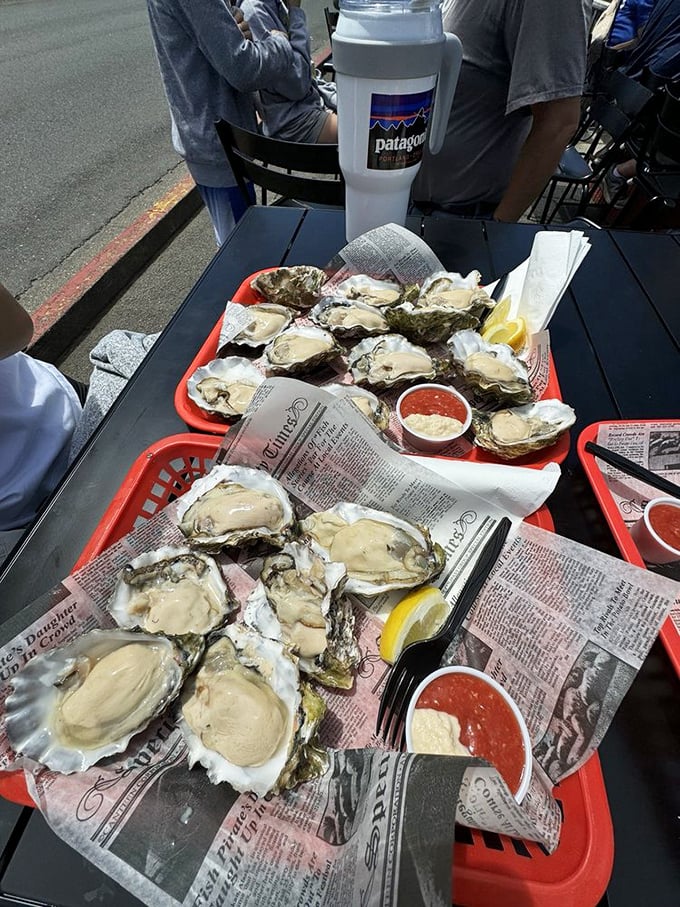 These oysters aren't just seafood; they're briny jewels of the Pacific, served simply with lemon and cocktail sauce as nature intended.