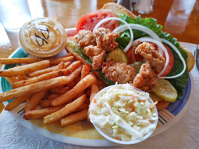 The oyster po' boy that transforms a simple sandwich into a masterclass in coastal comfort food perfection.