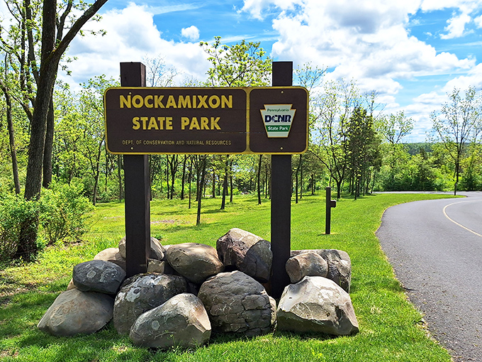 The gateway to adventure doesn't need to be fancy. This unassuming sign marks the boundary between ordinary life and the natural playground that awaits.