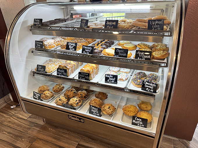 The pastry case stands as a glass-enclosed temple of temptation, where willpower goes to die and "I'll just have coffee" becomes "and that lemon bar, please."