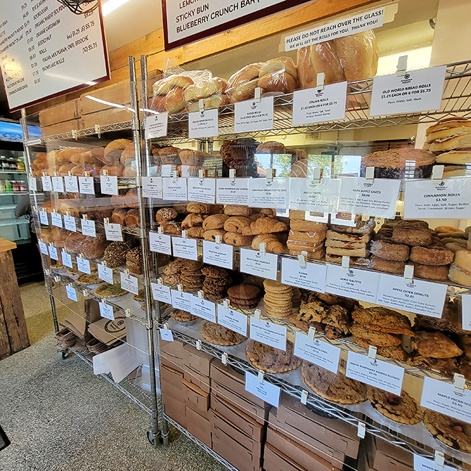 Carb heaven has shelves, and they're meticulously organized. This isn't just a bakery display—it's a museum of deliciousness.