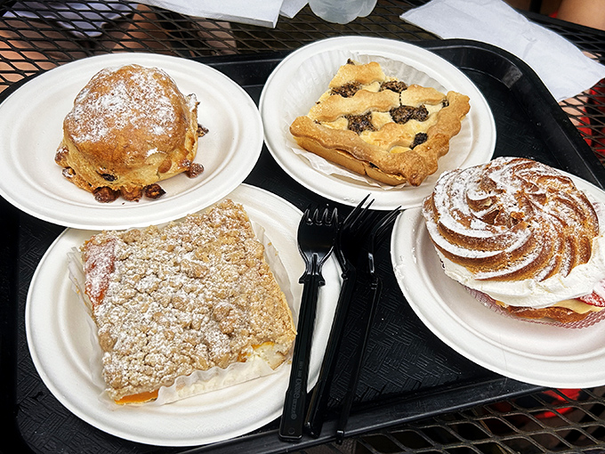 A quartet of pastries that could make a French patisserie blush with envy. That powdered sugar isn't decoration—it's a snowy blessing.