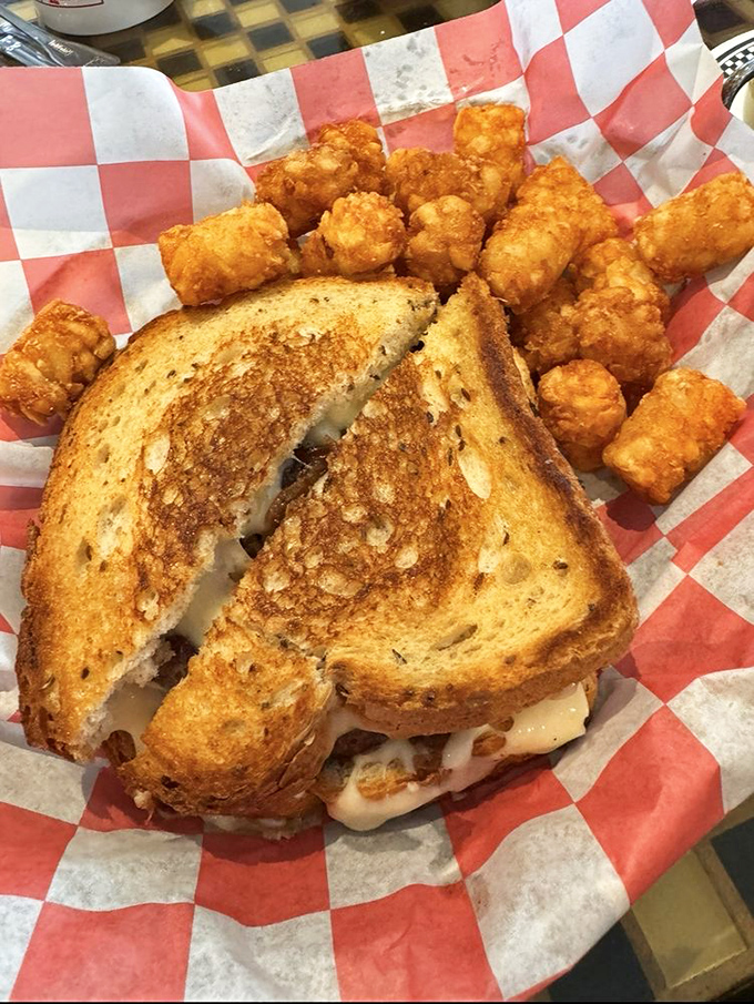 Grilled cheese perfection meets its crispy sidekick. This golden sandwich with tater tots proves some childhood favorites deserve adult appreciation.
