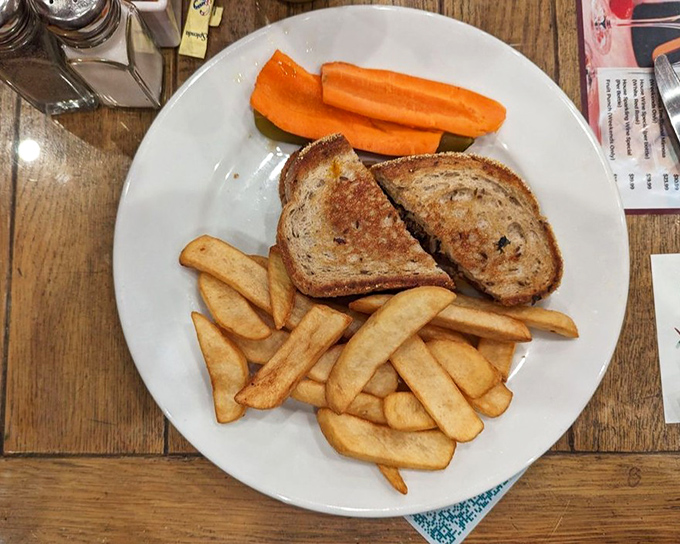 A patty melt that understands its purpose in life is to provide comfort, served with fries that clearly got the same memo.