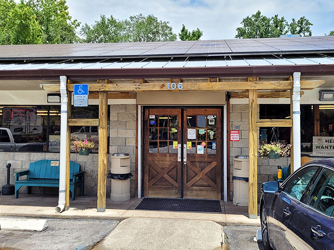 Solar panels meet country store charm at this local establishment. The wooden entrance says "welcome" in the most Micanopy way possible.