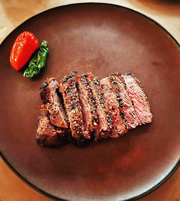 Sliced steak perfection revealing that glorious gradient from sear to center. Not just dinner, but edible evidence that patience and proper cooking temperatures are virtues worth celebrating.