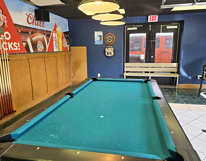 The pool table stands ready for friendly competition&mdash;because nothing builds an appetite for pizza like the sound of breaking balls.