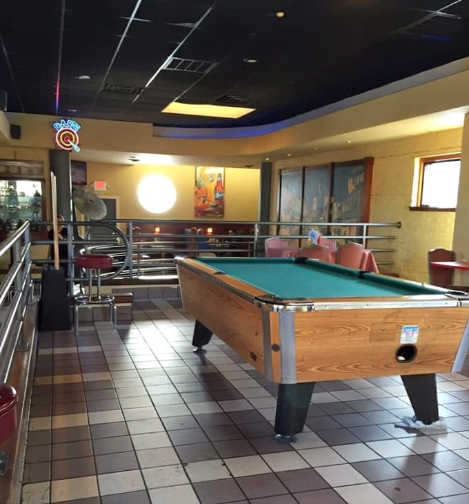 The pool table area provides that essential "third space" between restaurant and bar&mdash;where friendships are formed over friendly competition and shared appetizers.
