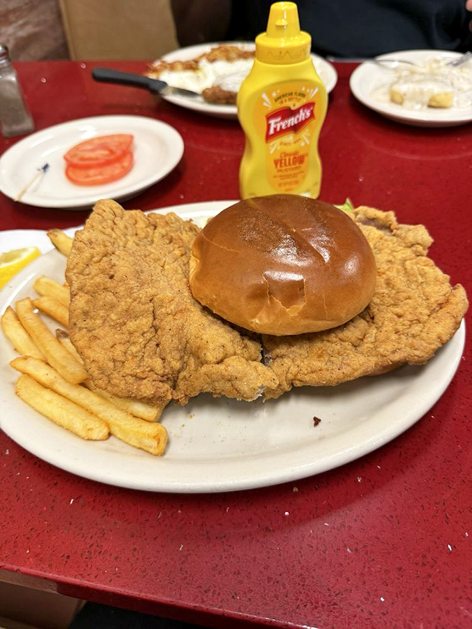 The pork tenderloin sandwich that proves sometimes bigger really is gloriously better.