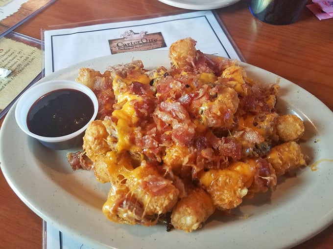 Tater tots elevated to art form &ndash; crispy potato nuggets crowned with cheese, bacon and pulled pork. Comfort food having its finest moment.