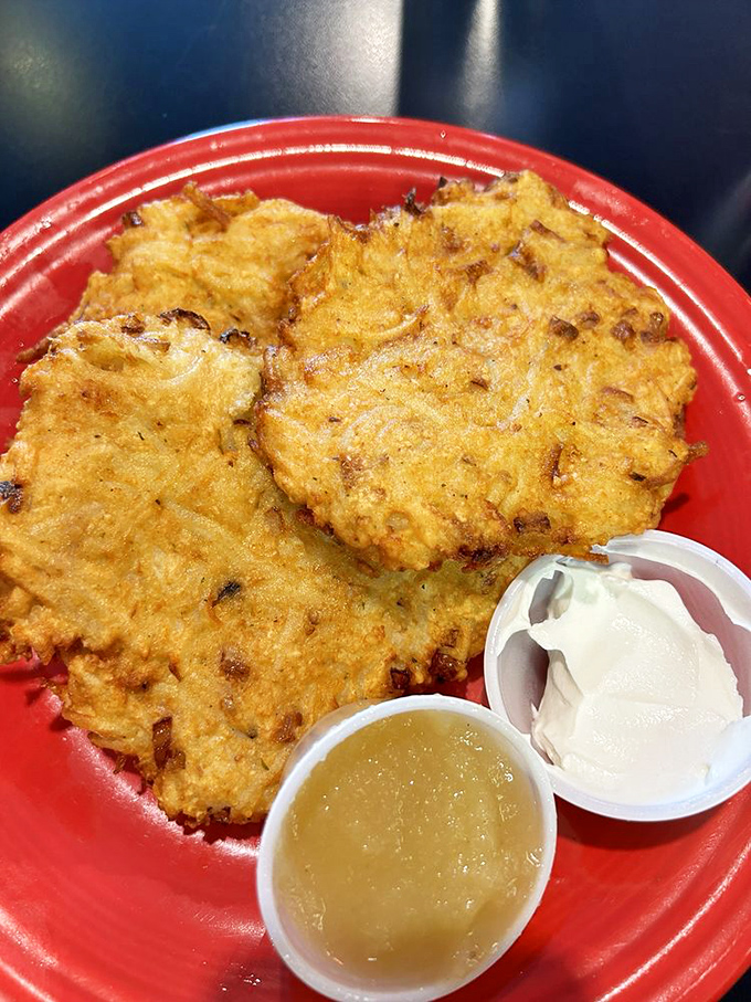 Potato pancakes that would make your grandmother weep with joy. Crispy, golden-brown latkes served with the traditional accompaniments of applesauce and sour cream.